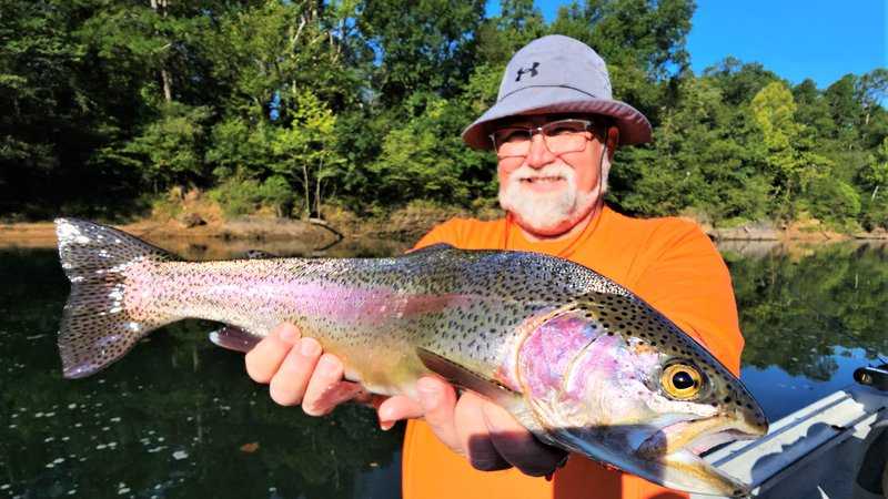 Keeling Grubb catches a 20 inch rainbow trout on the Beaver Lake Tailwater