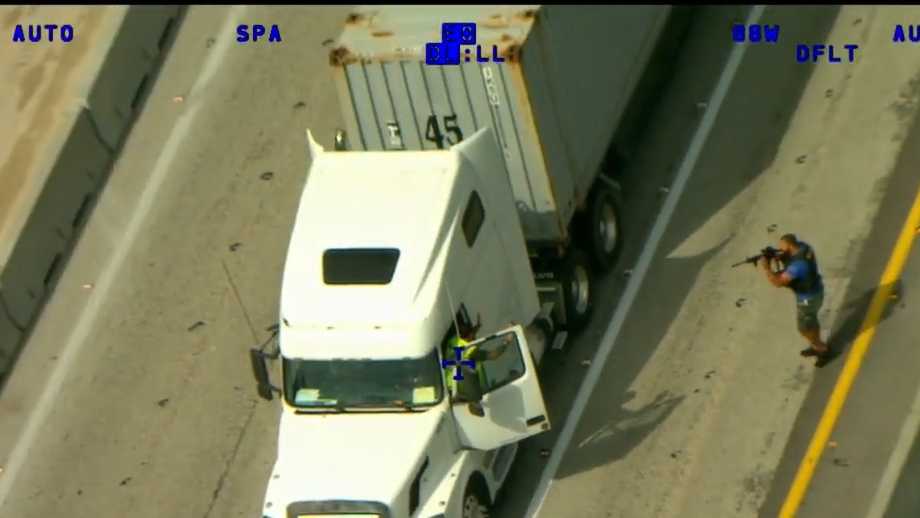 Police stop tractor-trailer on Interstate, arrest truck driver for murder