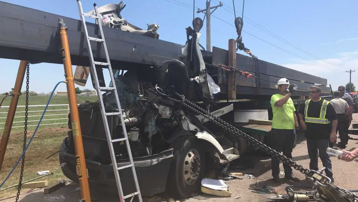 Driver rescued, taken to hospital after metal beam crashes through ...