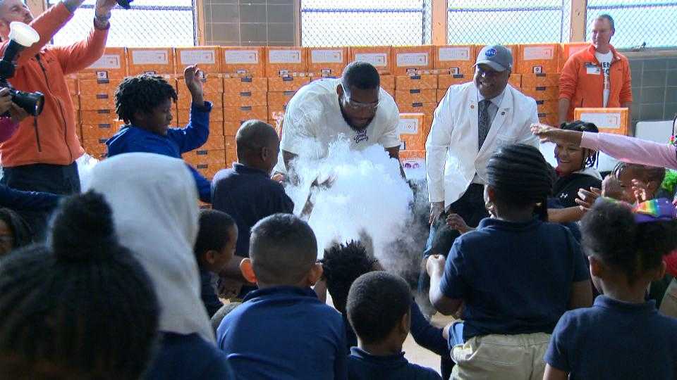 Tyus Bowser surprises students with space learning lunchboxes