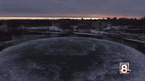 Large ice disk rotating slowly in Presumpscot River in Westbrook