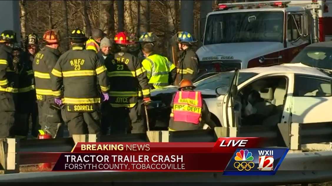 At least 1 person trapped in crash involving tractor-trailer, 3 vehicles
