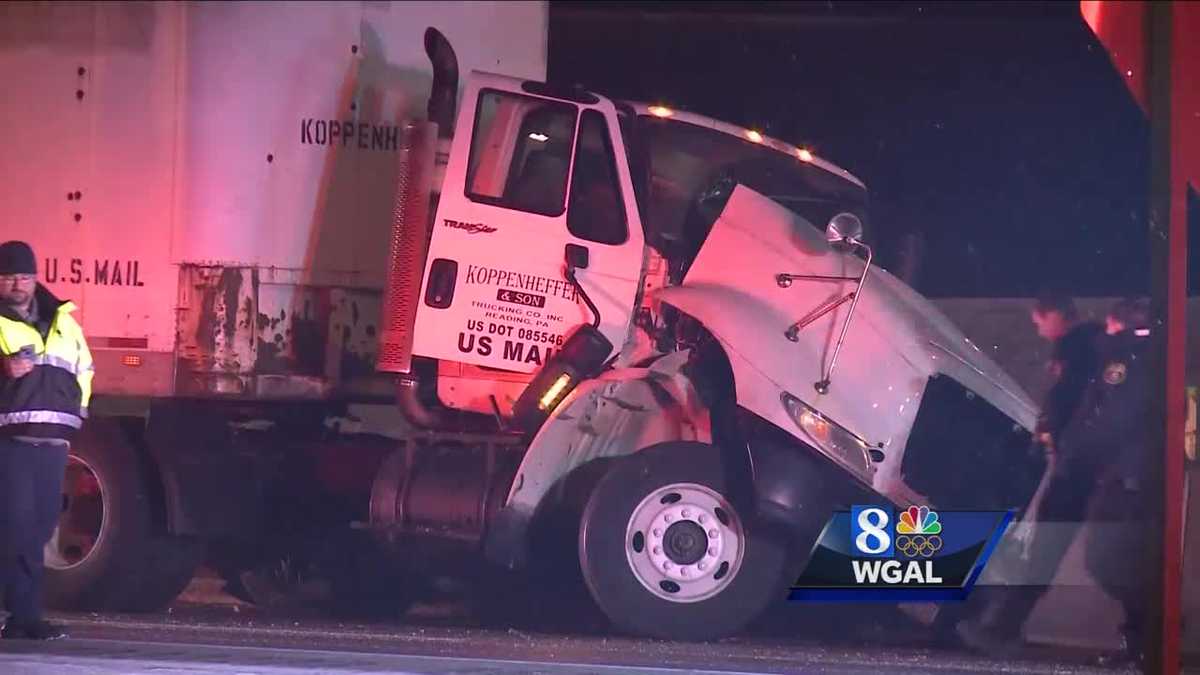 Postal truck slams into concrete barrier on Route 30