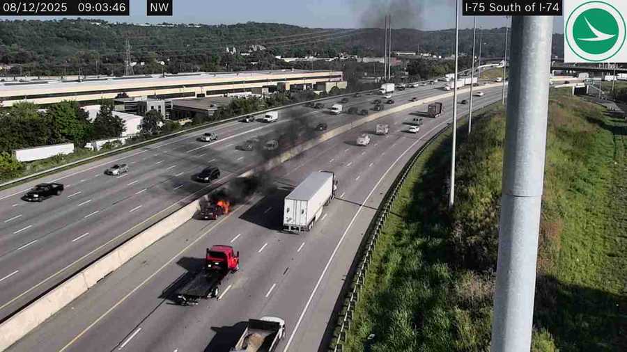 Flames engulfing a vehicle on I-75 northbound in Camp Washington