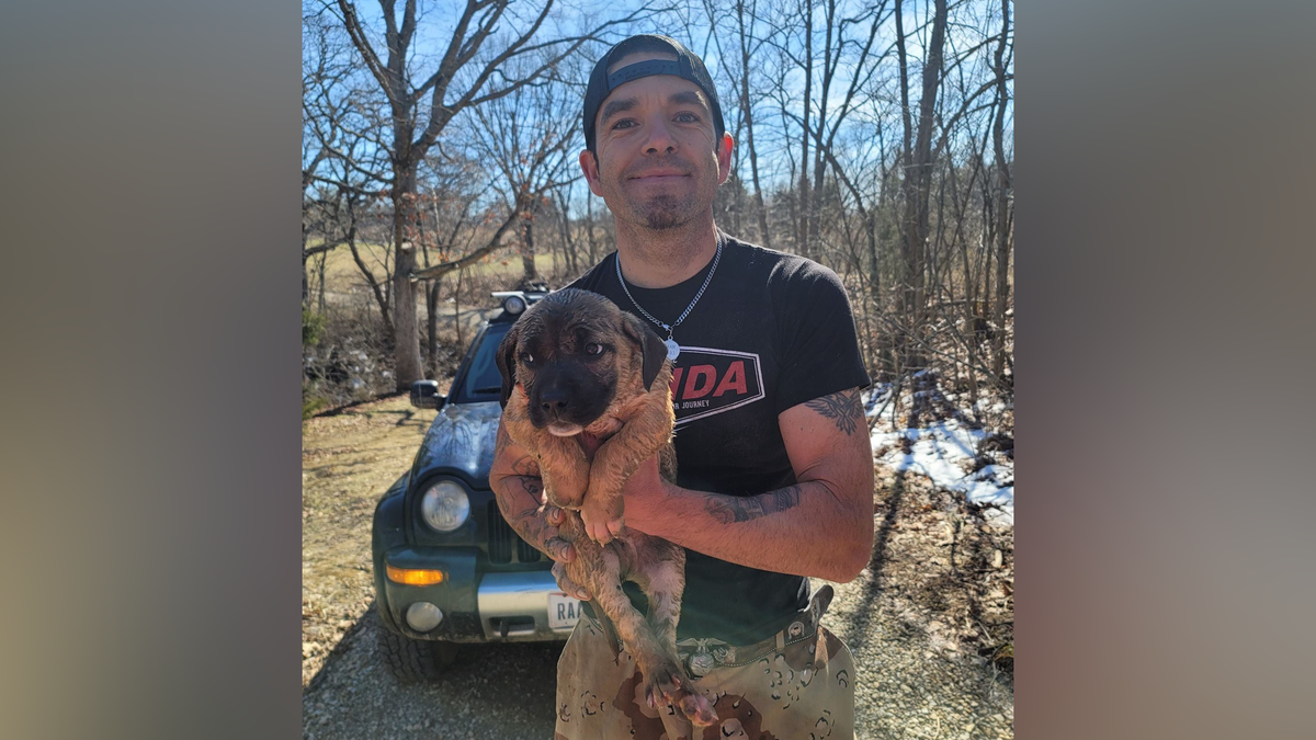 Ohio veteran scales 100 feet down ravine to save trapped puppy