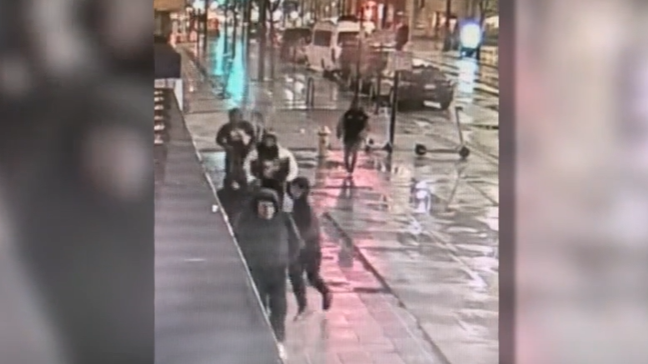 Video shows assault, robbery of victim by mob of people in downtown ...