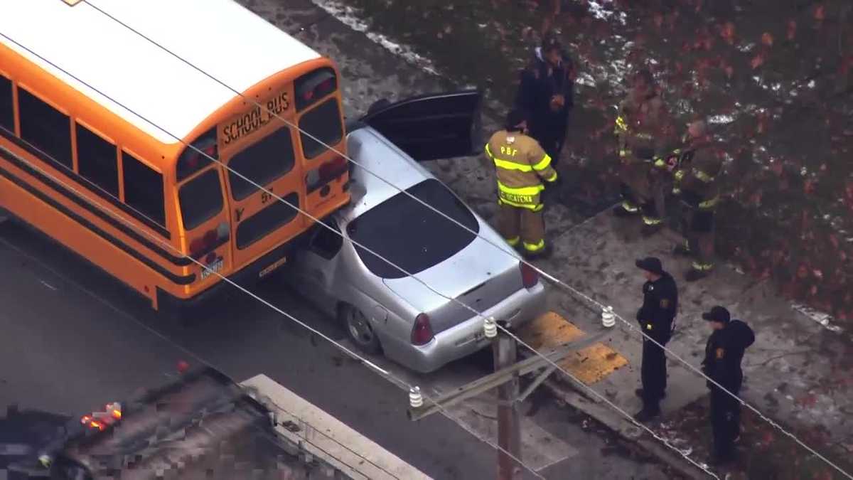 Crash pins car under school bus on South Braddock Avenue near Frick Park