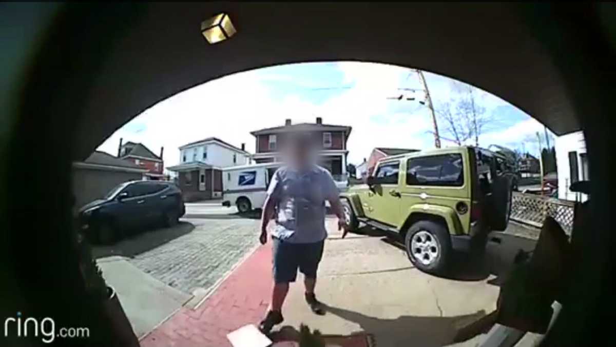 Surveillance camera catches USPS worker dropping and kicking packages