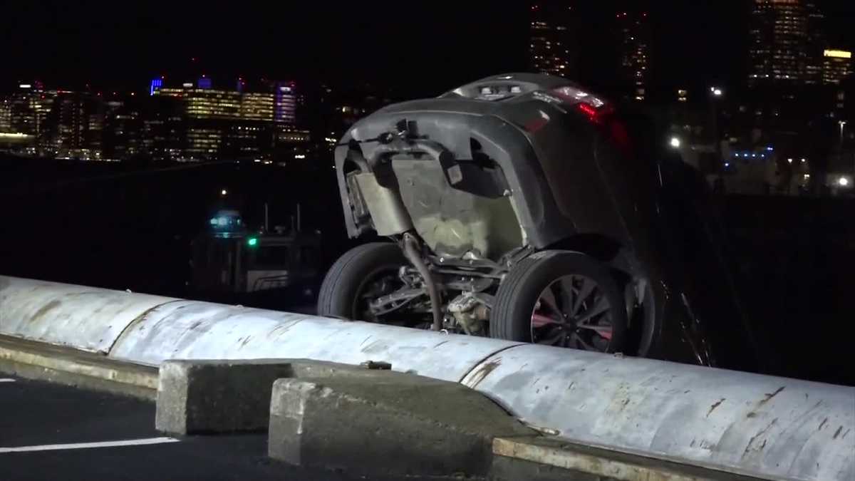 Car plunges off Charlestown pier, saved from water by small dock