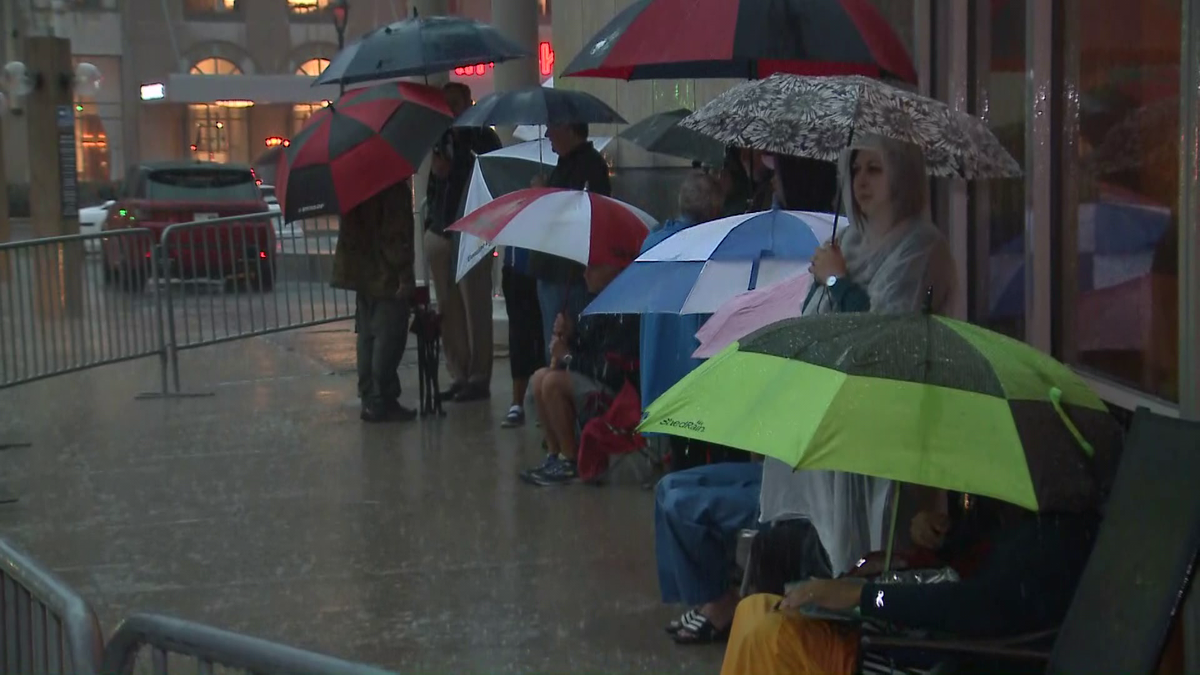 People line up in rain for 'Hamilton' tickets