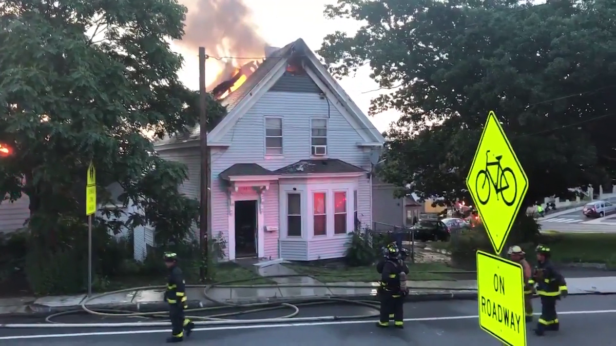 Firefighters battle fire in Lawrence home
