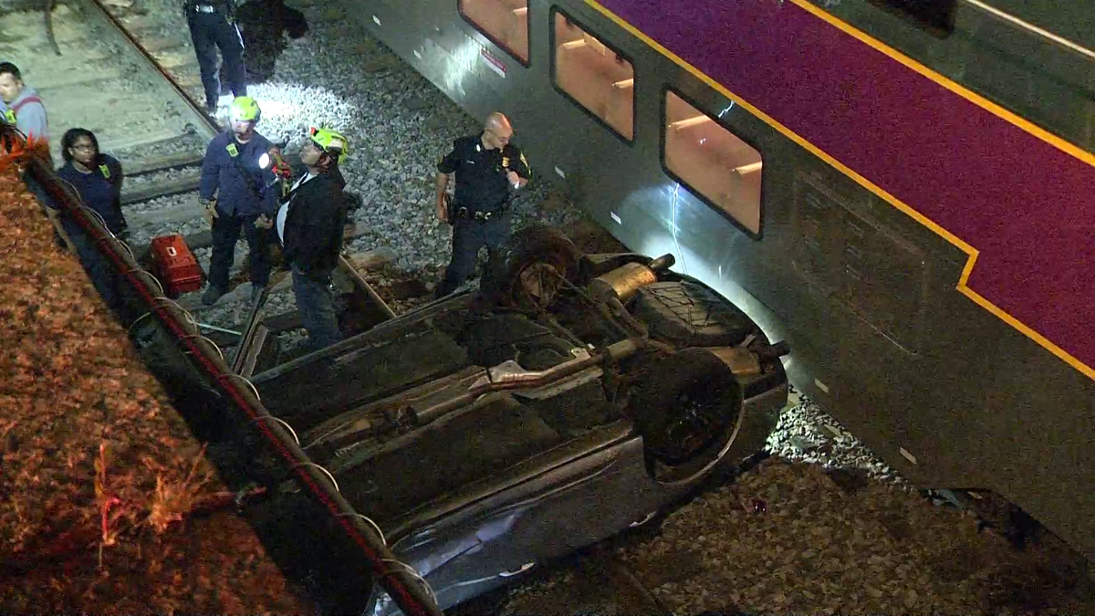 Boston crash sends car off road onto train tracks 20 feet below