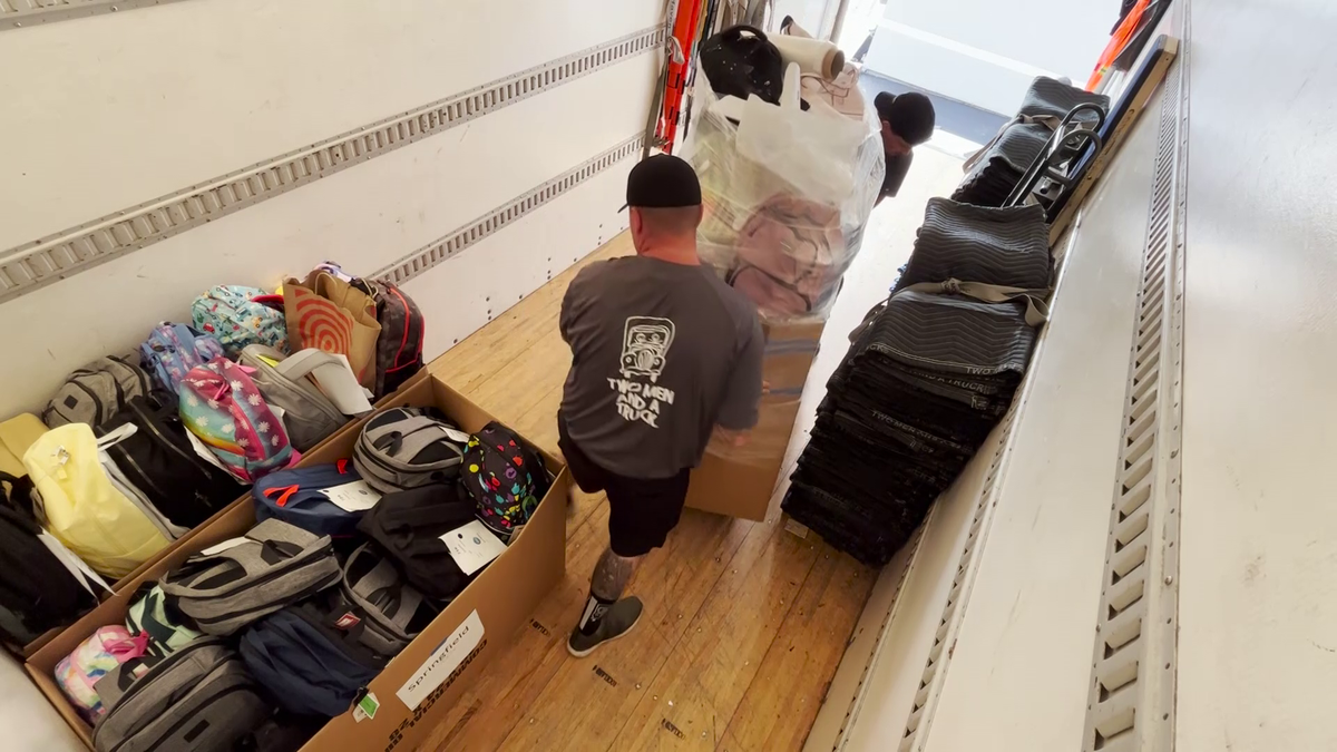 Moving company helps give back with backpacks filled with school ...