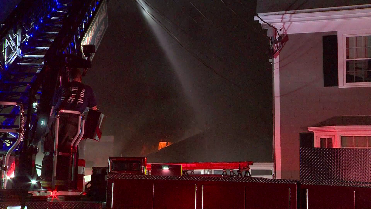 Firefighter falls through floor while battling blaze
