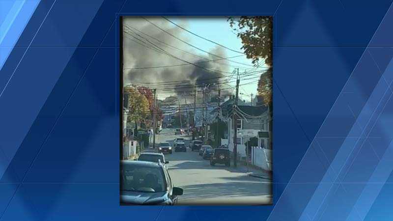Firefighters battle 3-alarm fire at commercial building in Waltham
