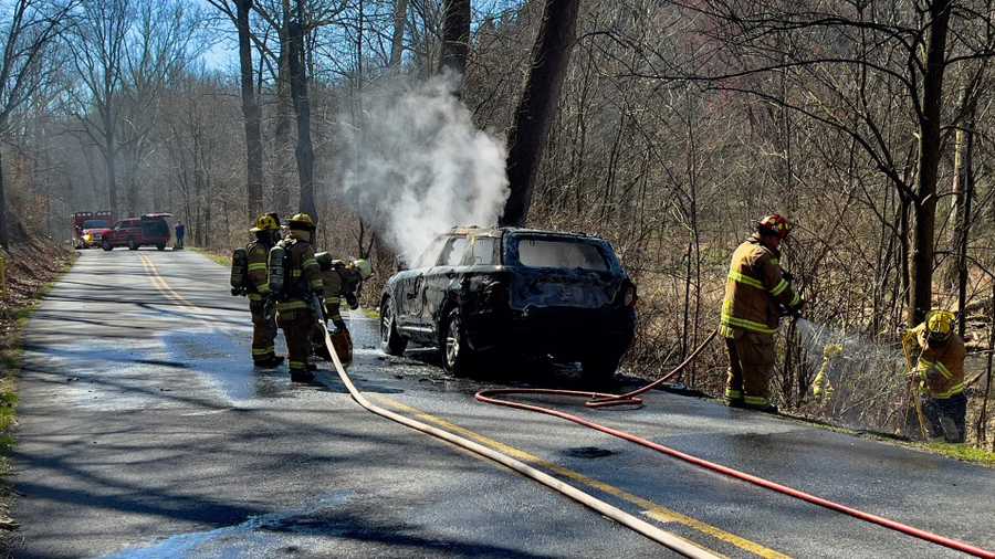 Vehicle, brush fire shuts down road in Lancaster County, Pa.
