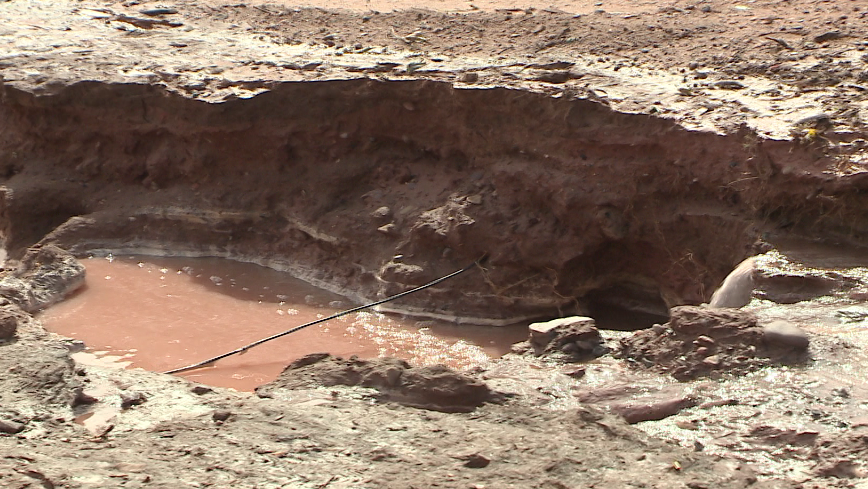 Impassable washed out roads trapped families in their homes