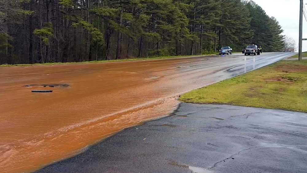 Broken water main floods road, impacts water service