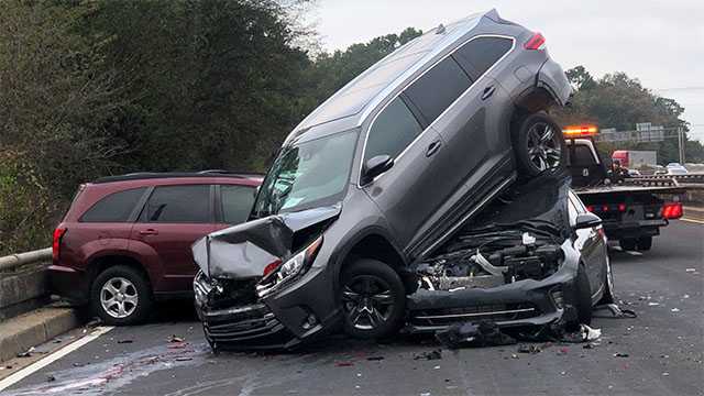 4-vehicle crash ends with SUV on top of car