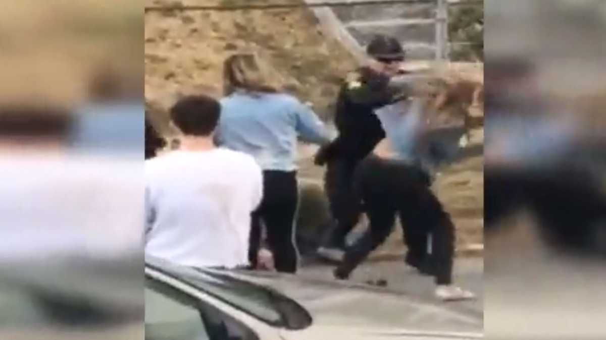 Video shows officer hitting woman, but police say there's more to story Video shows officer hitting woman, but police say there's more to story