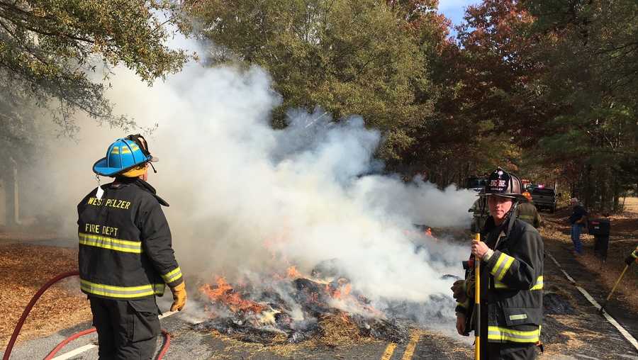 Road shut down after hay bales catch fire
