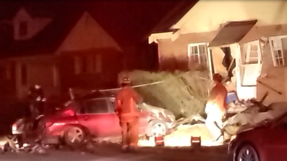 Police: Car crashes into home in Westwood