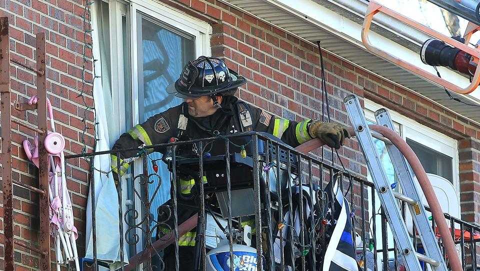 Firefighter hurt falling off ladder during response to apartment fire