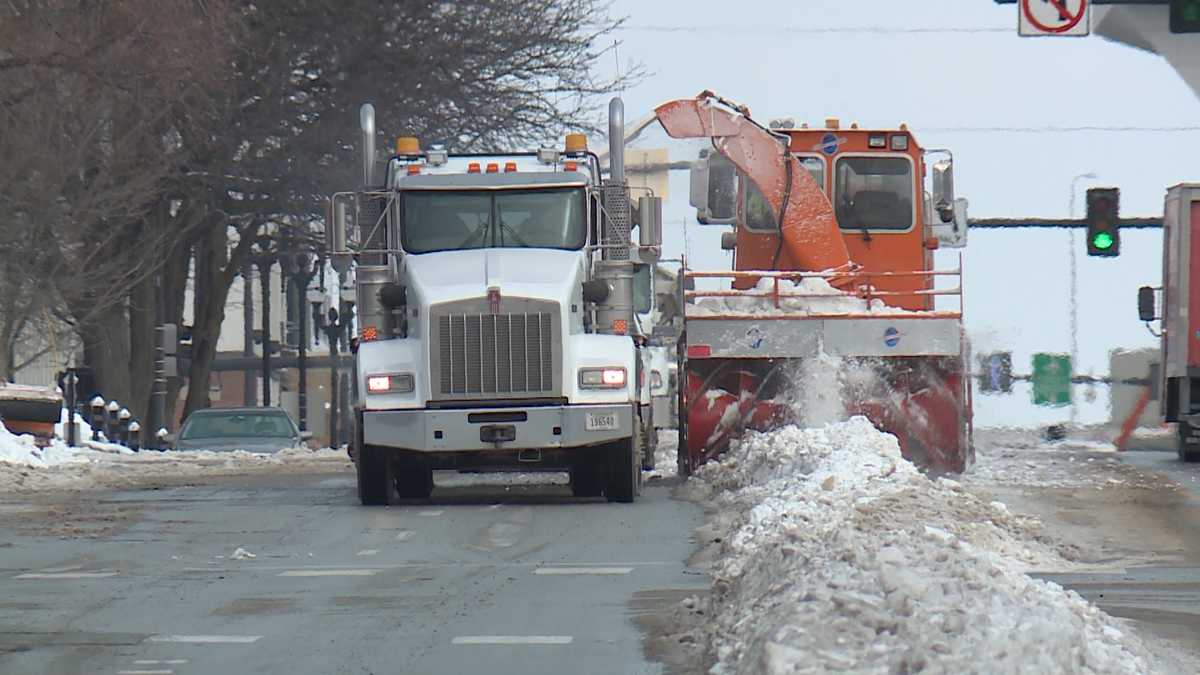 City crews scoop up snow windrows in downtown Omaha