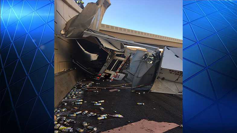 Beer truck rolls over in Mitchell Interchange, spilling beer cans