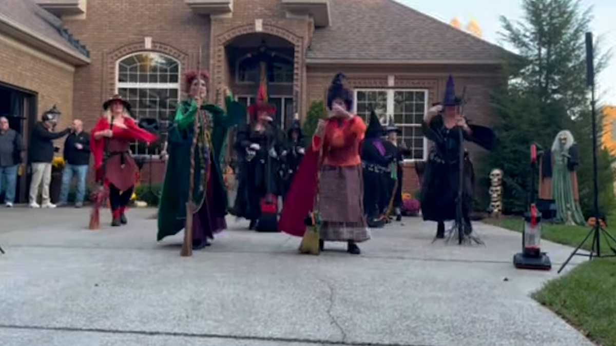 Louisville neighbors dresses up as witches, dance for trick-or-treaters
