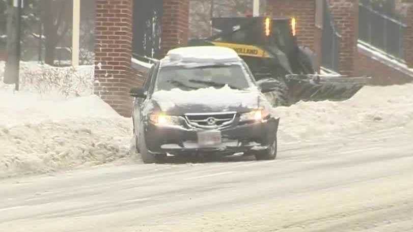Car can't stop sliding down icy hill