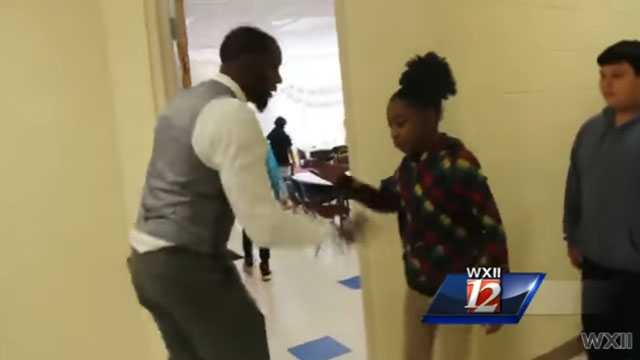 North Carolina teacher greets each student with personalized handshake
