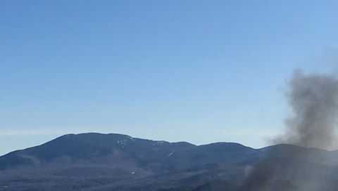 Crews work to put out flames at home near Sunday River