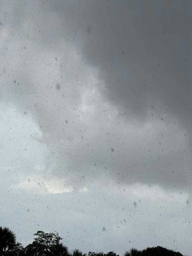 Funnel cloud forms near downtown Melbourne