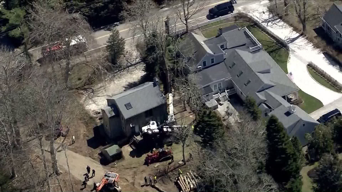 Crane topples, crushes home's deck on Cape, closes roadway