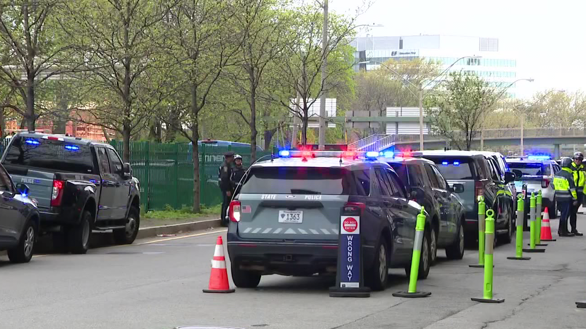 Police gather outside hospital following trooper's death