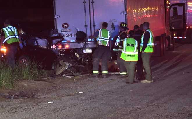 Car hit parked tractor-trailer, driver killed