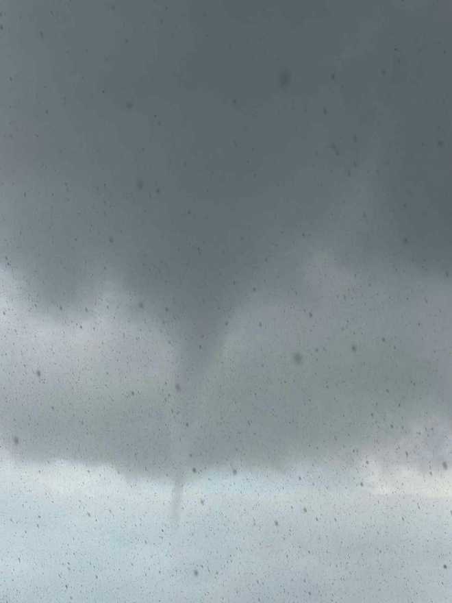 Funnel cloud forms near downtown Melbourne