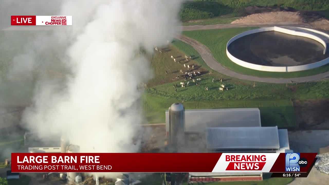 Dozen fire departments fight barn blaze at West Bend dairy farm - WISN