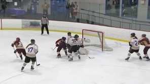 Norwich's, Madison Gallagher, dives for the rebound, and goal