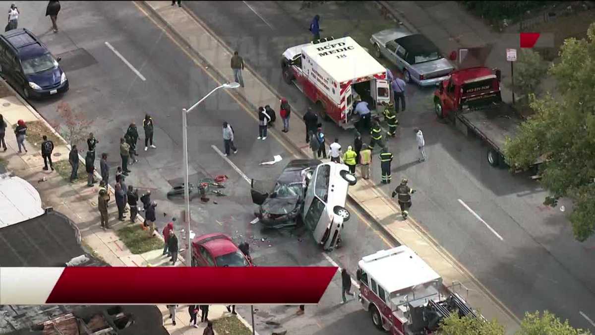 Crews rescue person trapped in crash in which car turned onto its side