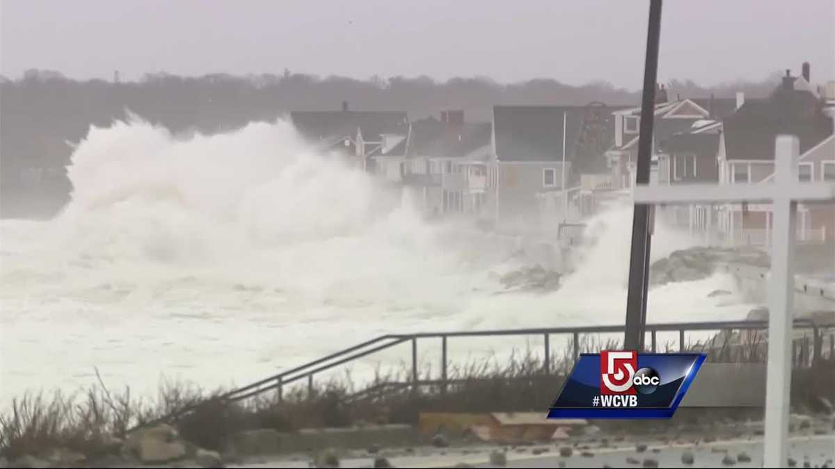 Water splashes over Scituate seawall during high tide