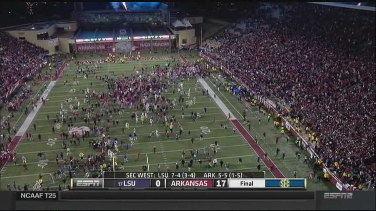 Razorbacks fined after fans rush the field