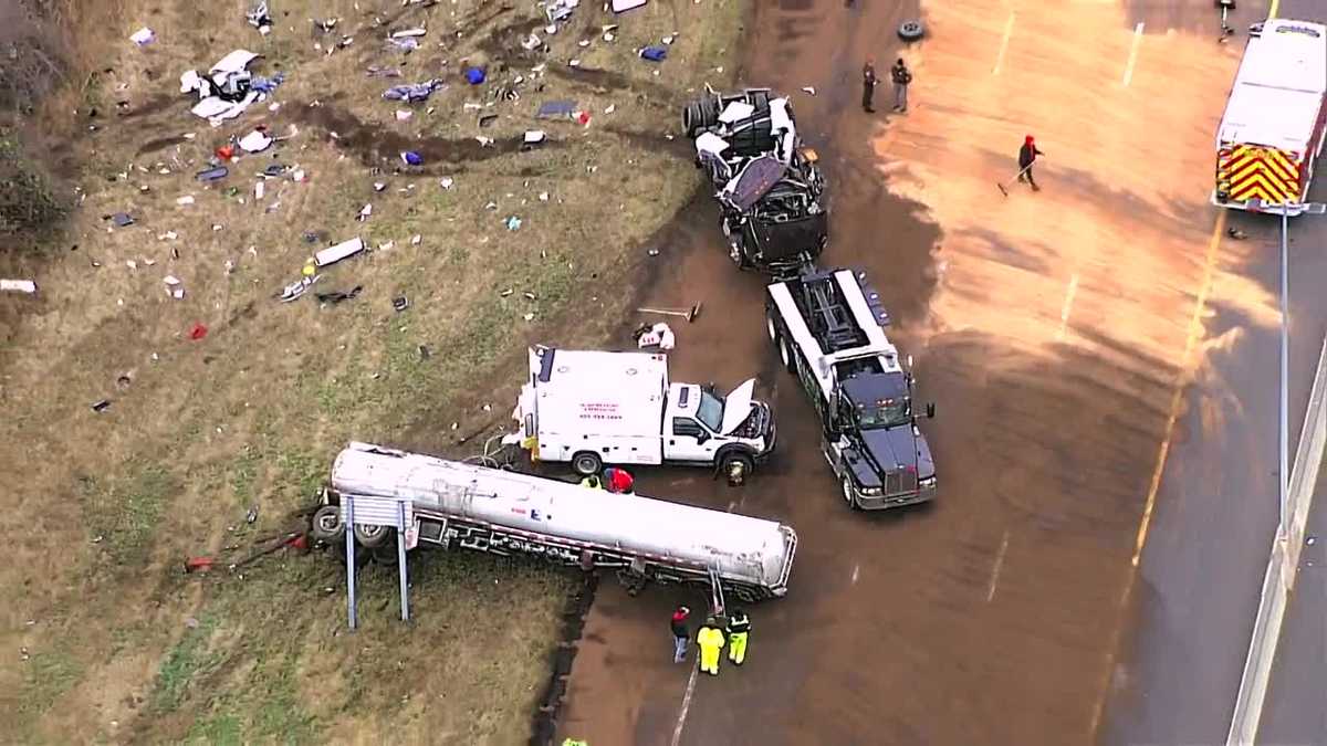 Heavily damaged overturned semi causes spill on Interstate 40
