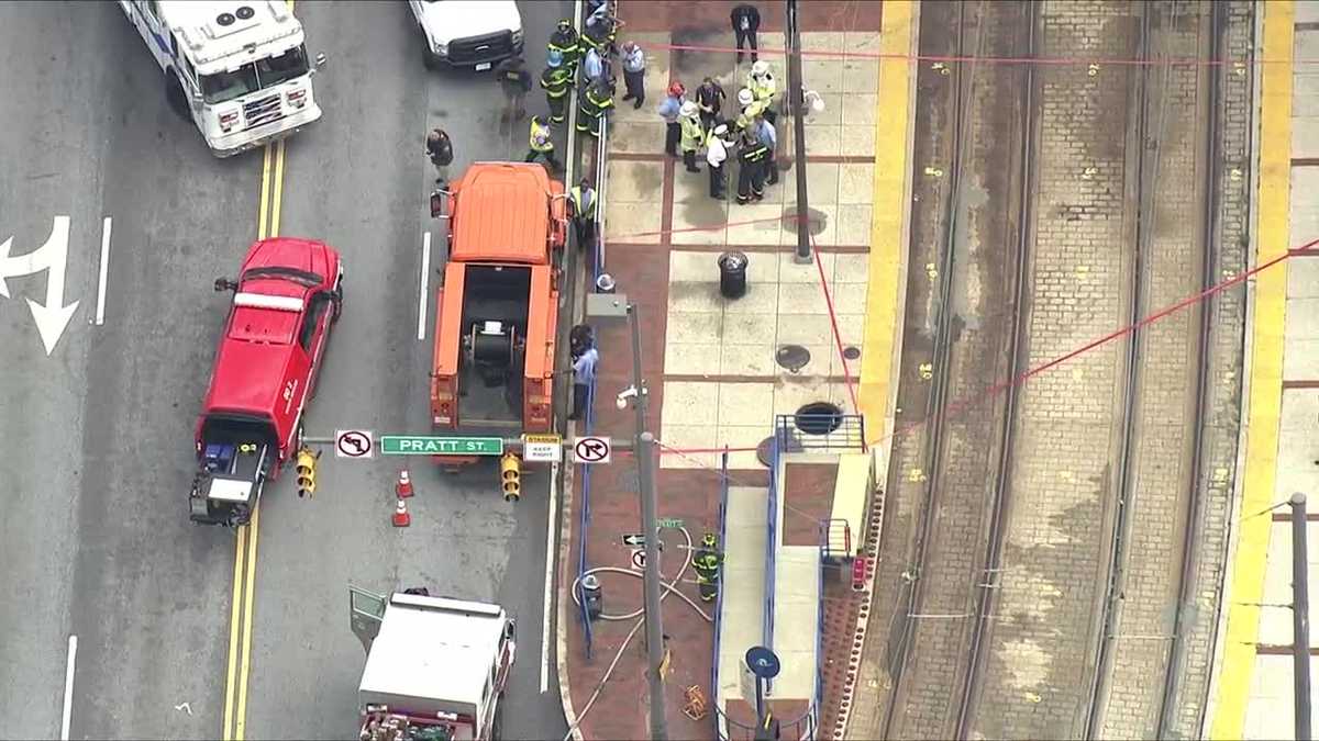 Crews rescue worker trapped in manhole in downtown Baltimore