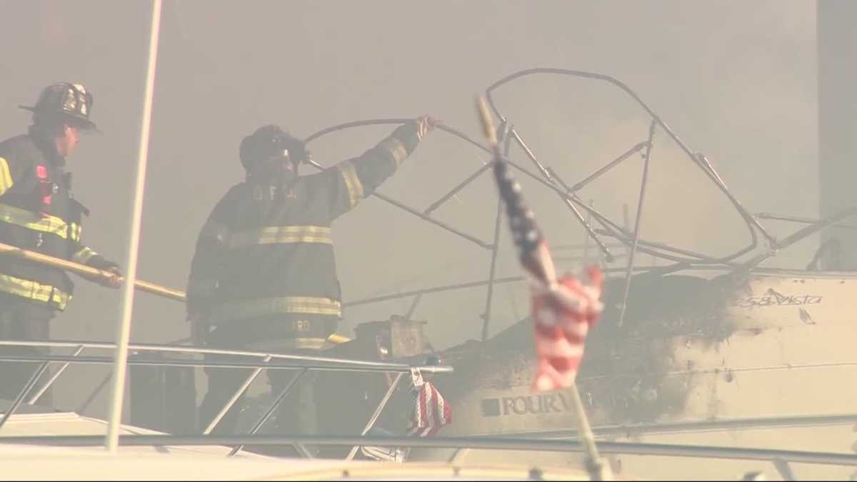 Crews to raise sunken boats after massive marina fire