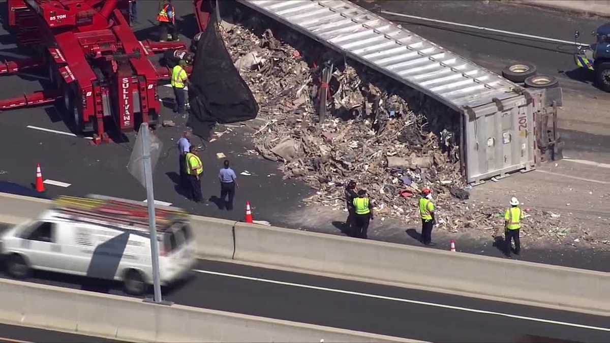 Video: Tractor-trailer overturns on I-895