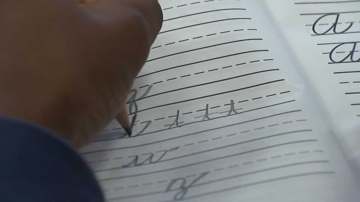 Kids learn cursive handwriting at free academy