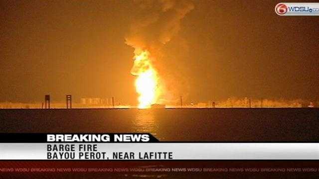 Barge fire continues to burn in Bayou Perot