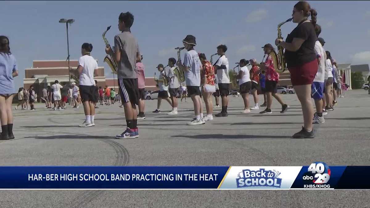 Har-Ber High School marching band practices around the heat